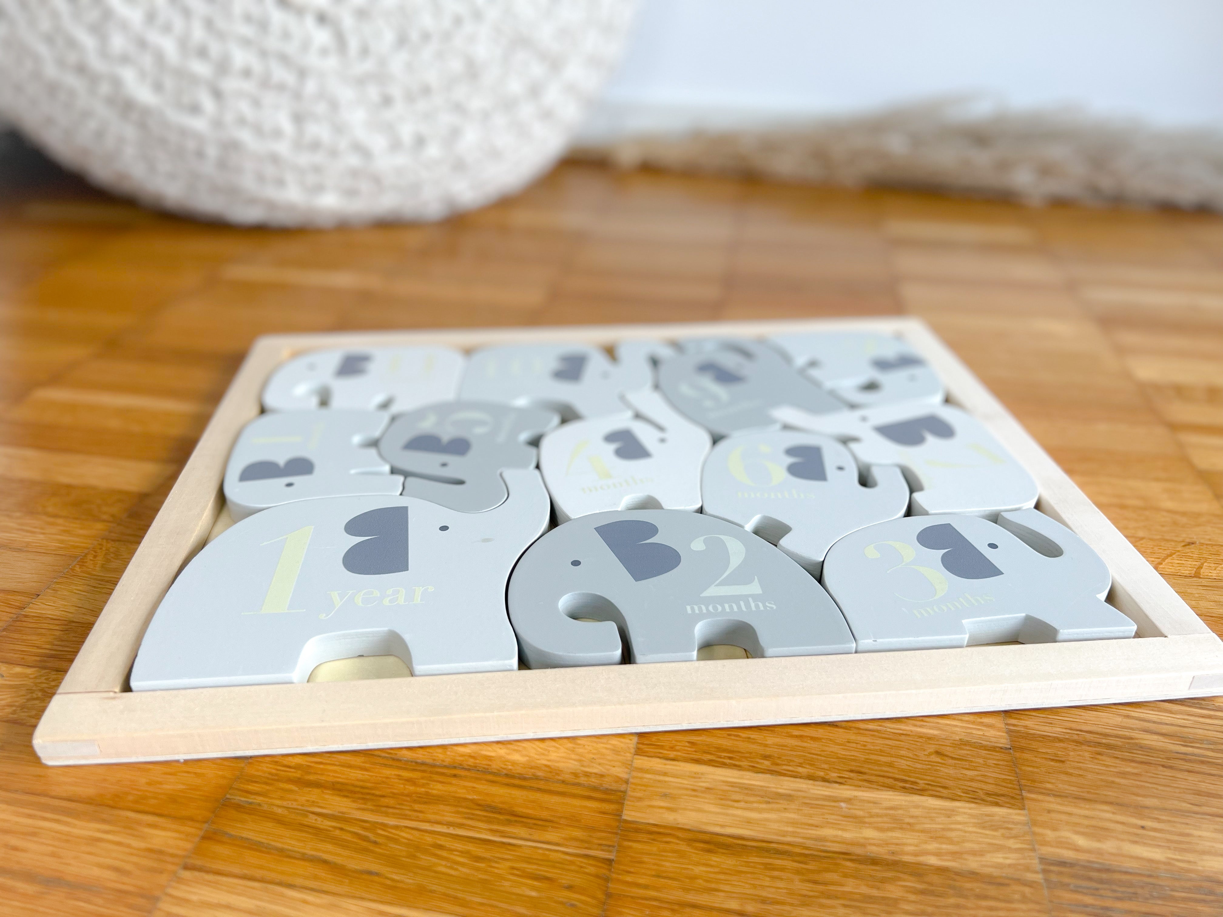 Wooden elephant puzzle including baby milestones